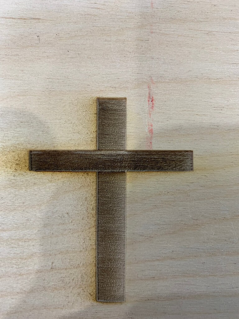 Engraving a cross, The horizontal line engraving deeper than the ...