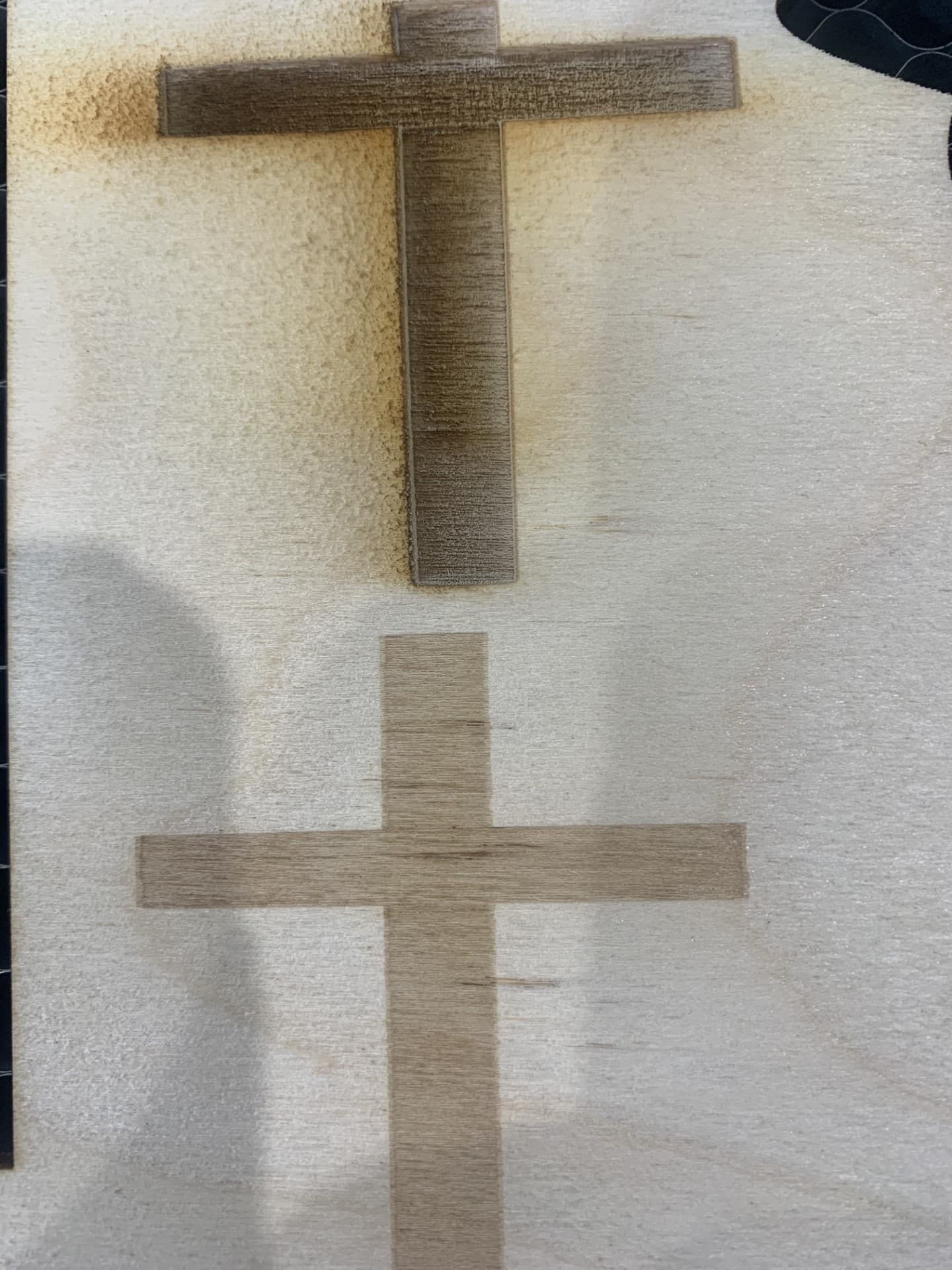 Engraving a cross, The horizontal line engraving deeper than the ...